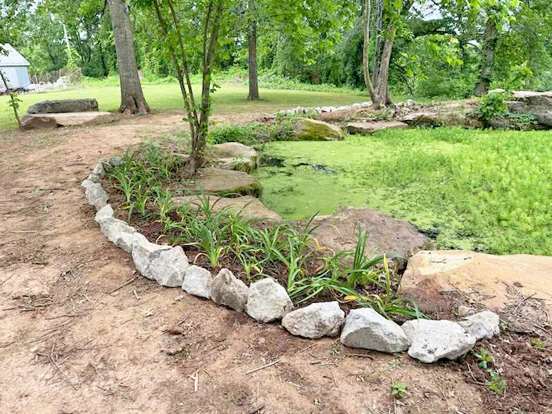 Volunteers work to spruce up waterfall area of Spring Park – Colbert ...